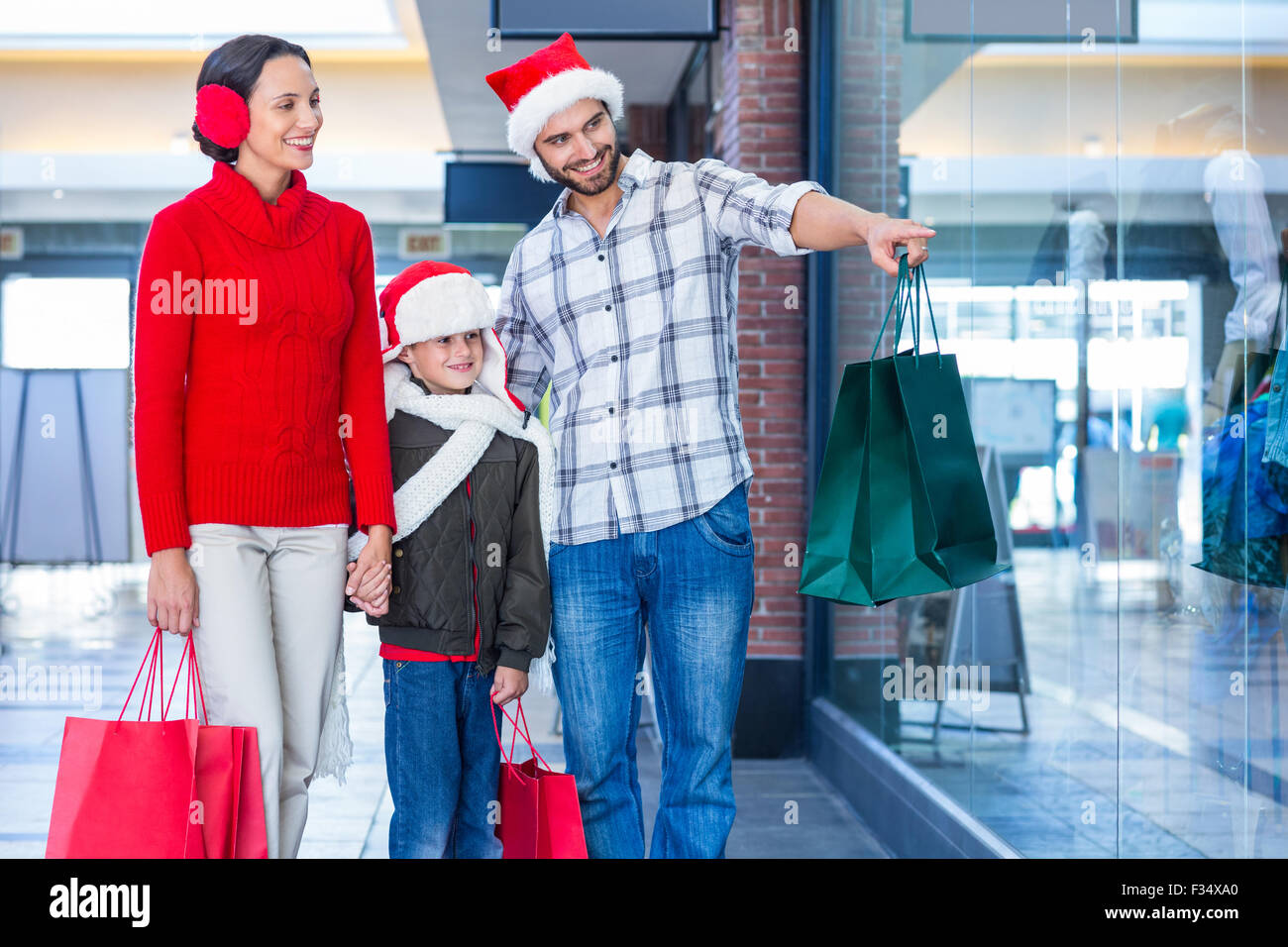 Happy family looking at camera Stock Photo - Alamy