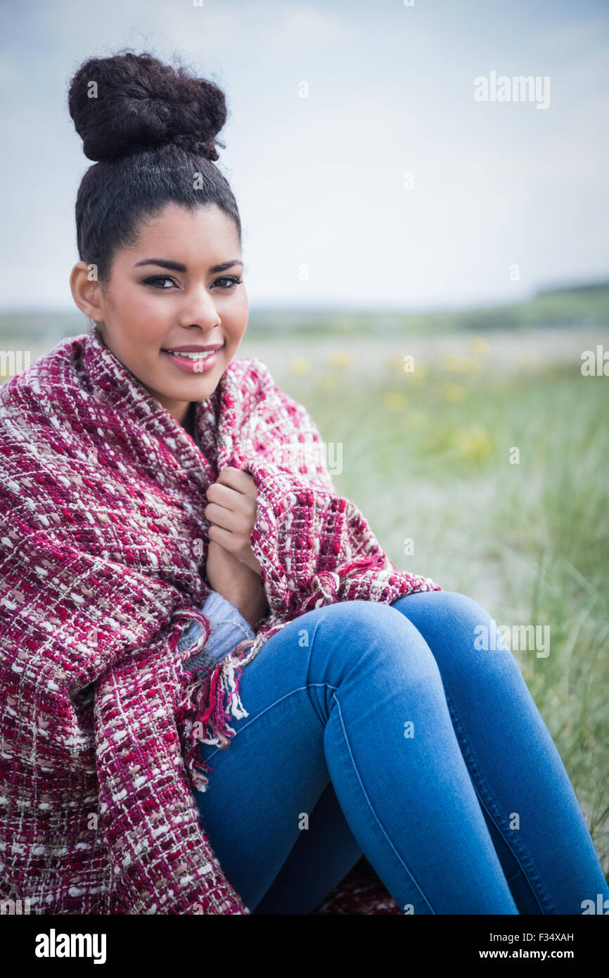 Beautiful woman wrapped up in warm clothing Stock Photo - Alamy