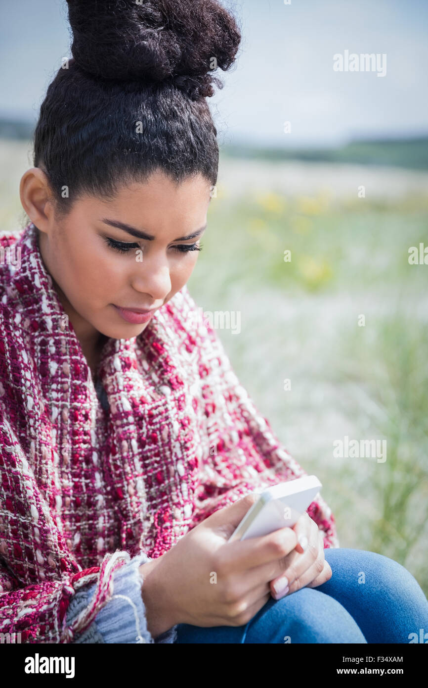 Beautiful woman using her smartphone Stock Photo - Alamy
