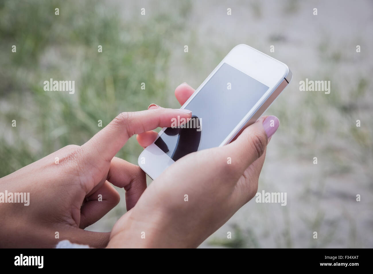Beautiful woman using her smartphone Stock Photo - Alamy