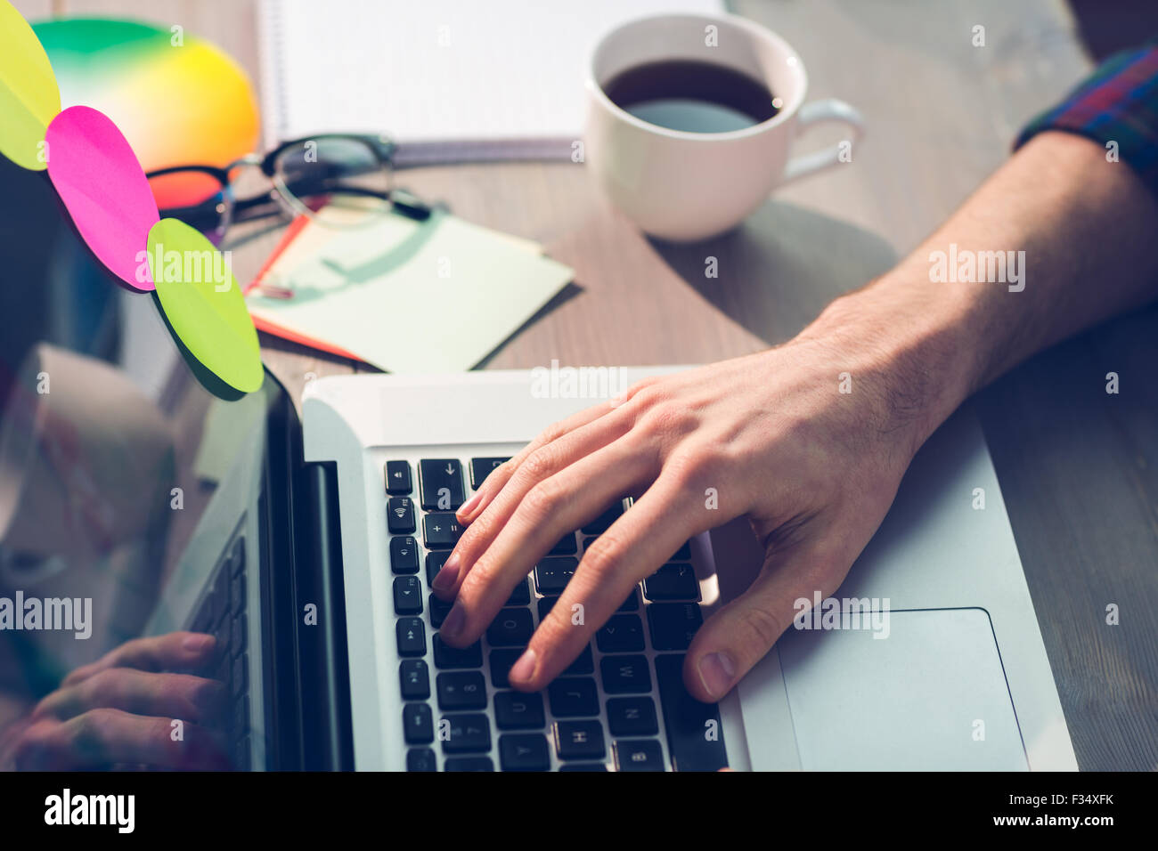 Cropped hand of graphic designer working on laptop Stock Photo - Alamy
