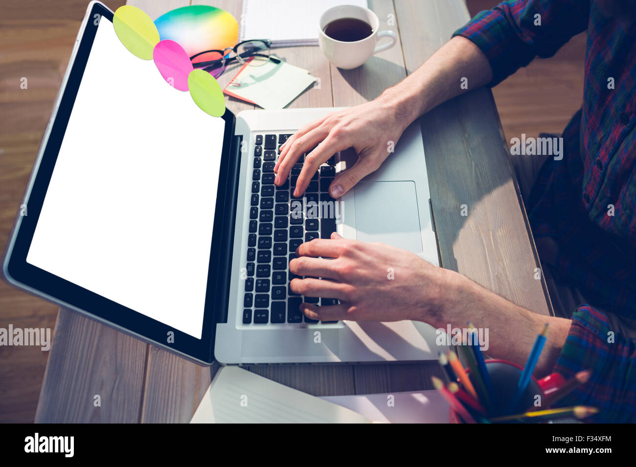 Midsection of creative graphic designer on laptop Stock Photo - Alamy