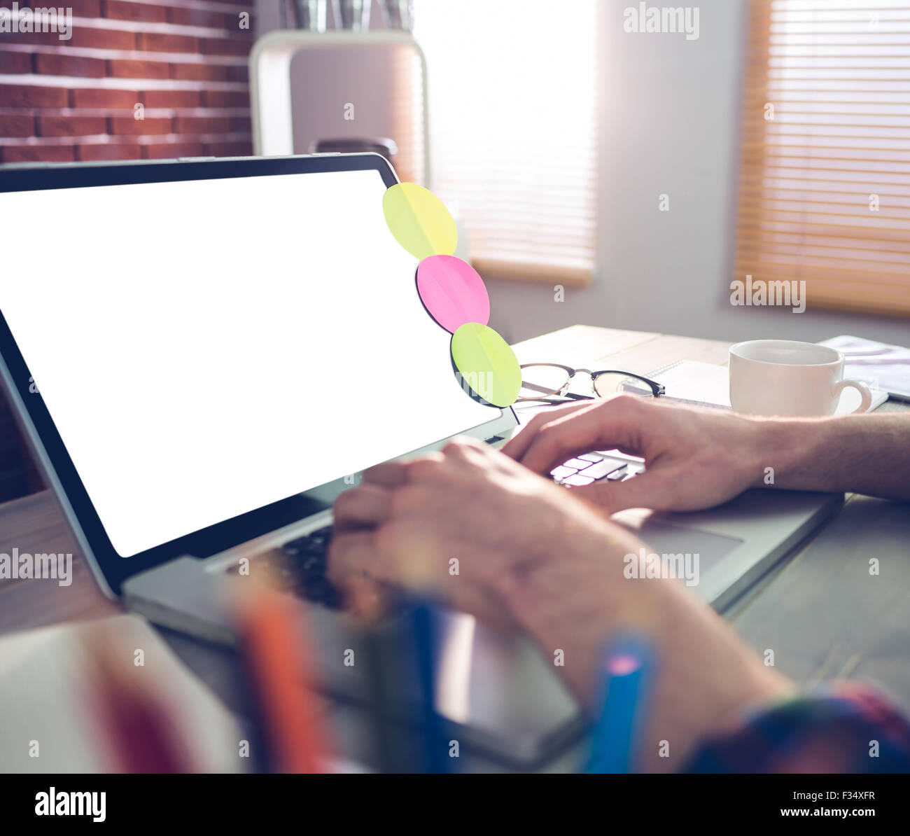 Cropped image of graphic designer working on laptop Stock Photo - Alamy