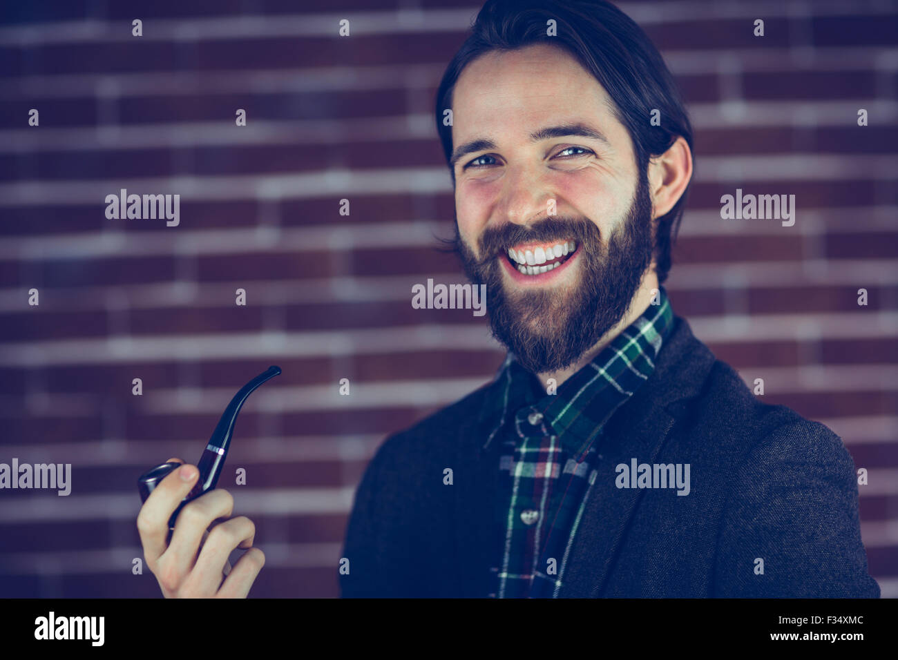 Portrait happy man holding pipe hi-res stock photography and images - Alamy