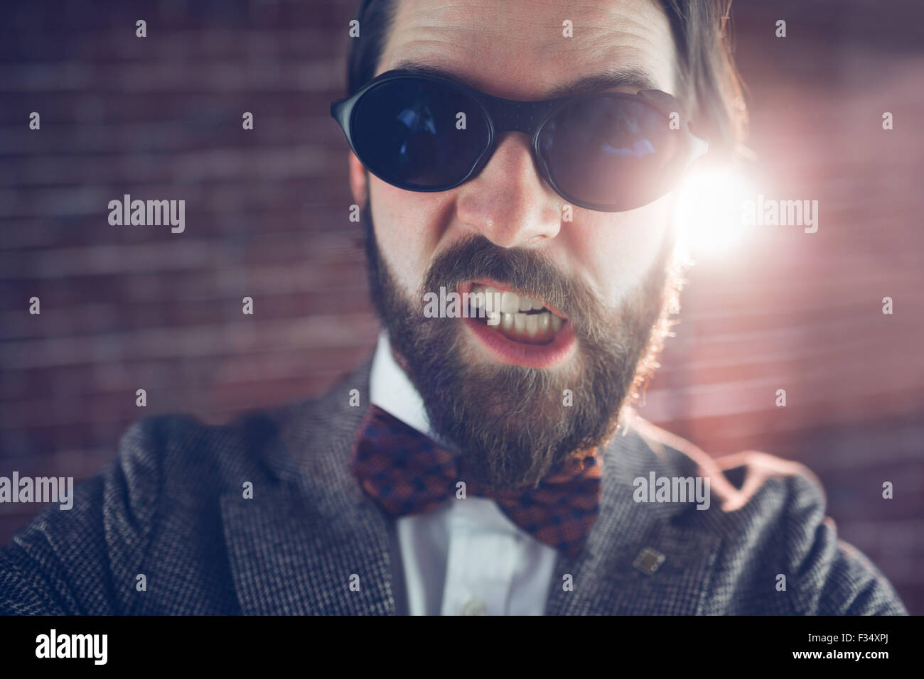 Portrait of angry fashionable man wearing sunglasses Stock Photo - Alamy
