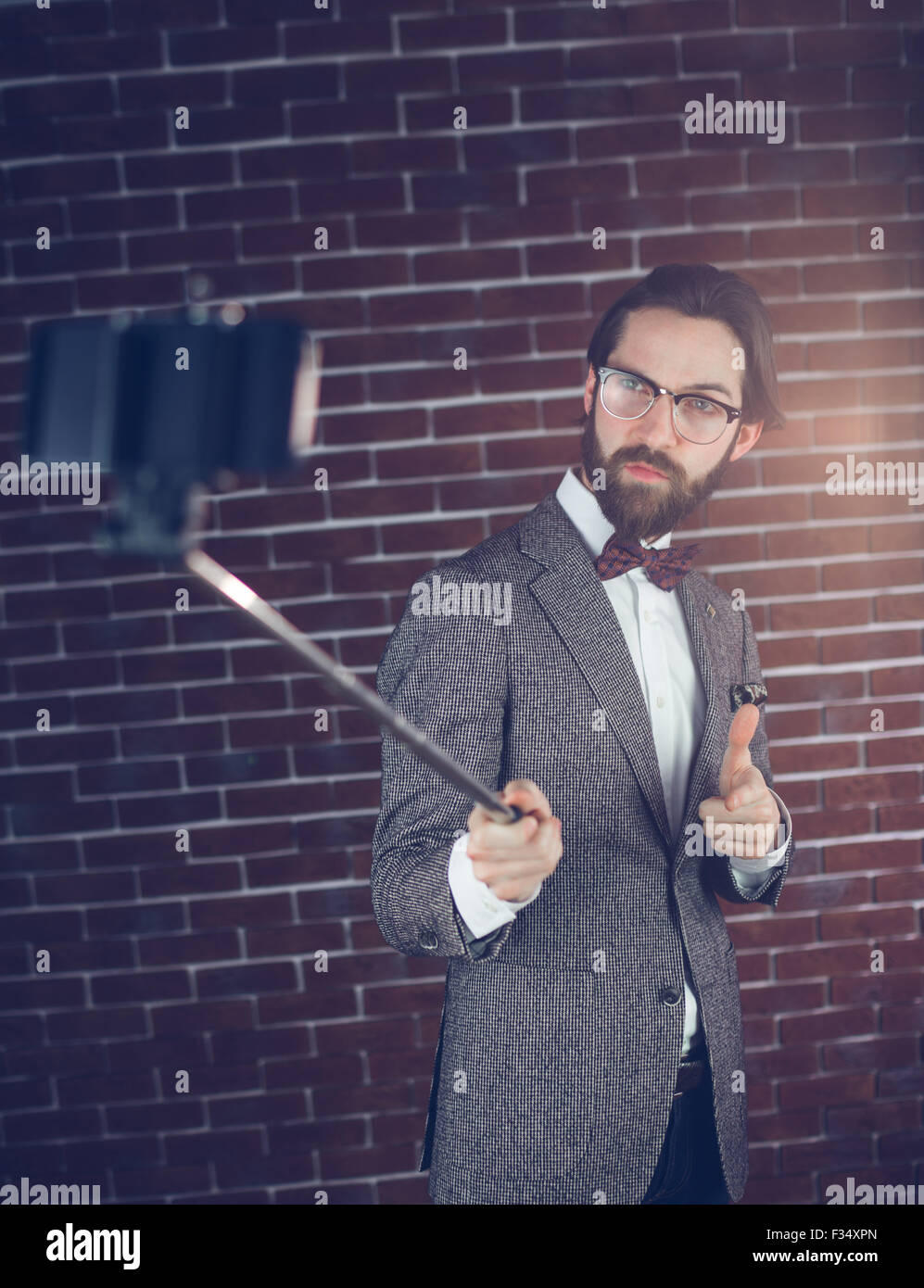Confident man taking selfie through smartphone Stock Photo - Alamy