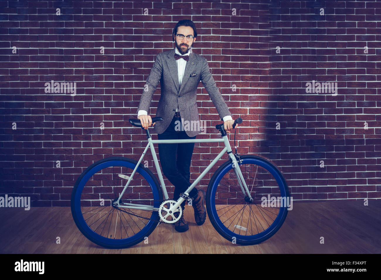 Portrait of confident man with bicycle Stock Photo - Alamy