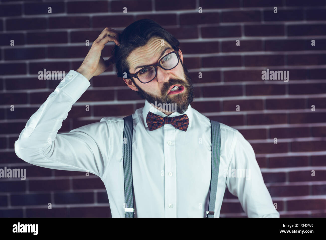 Portrait of man scratching head Stock Photo - Alamy