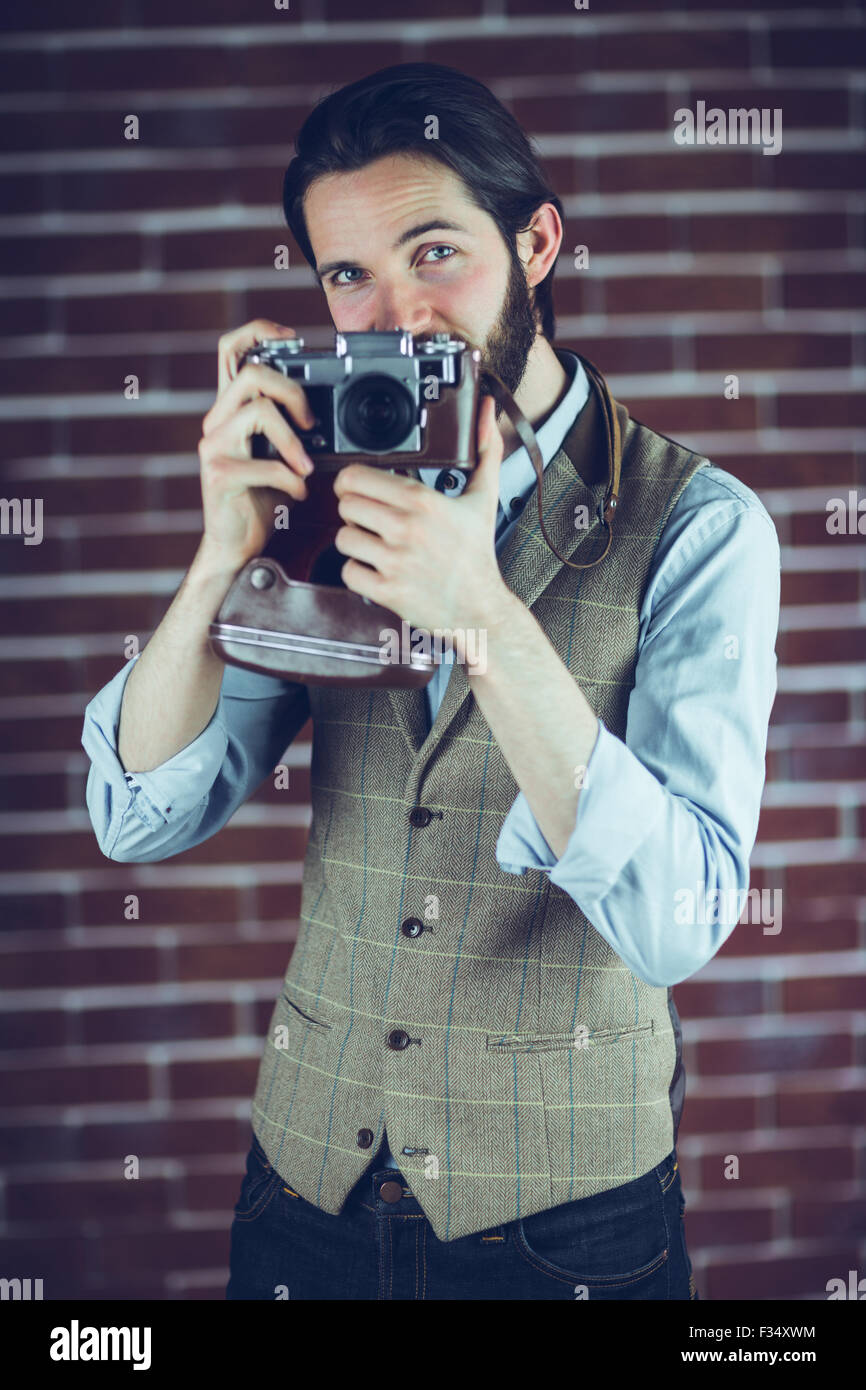 Portrait of hipster photographing Stock Photo - Alamy