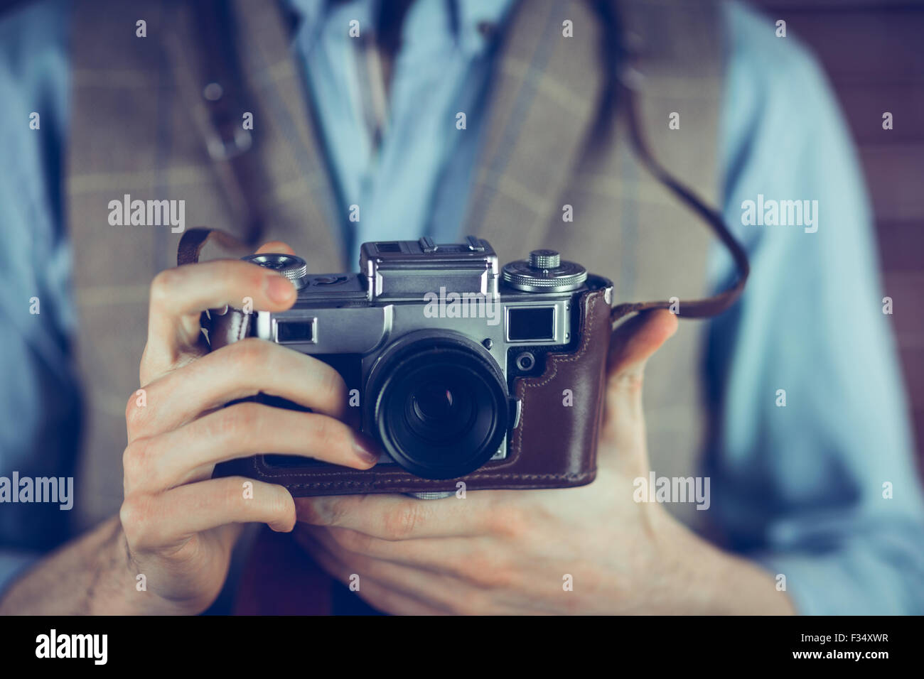 A Man holding a camera Stock Photo - Alamy
