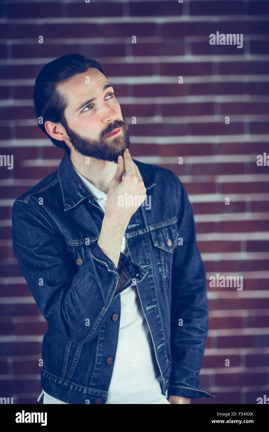 Thoughtful handsome with hand on chin man looking away Stock Photo - Alamy