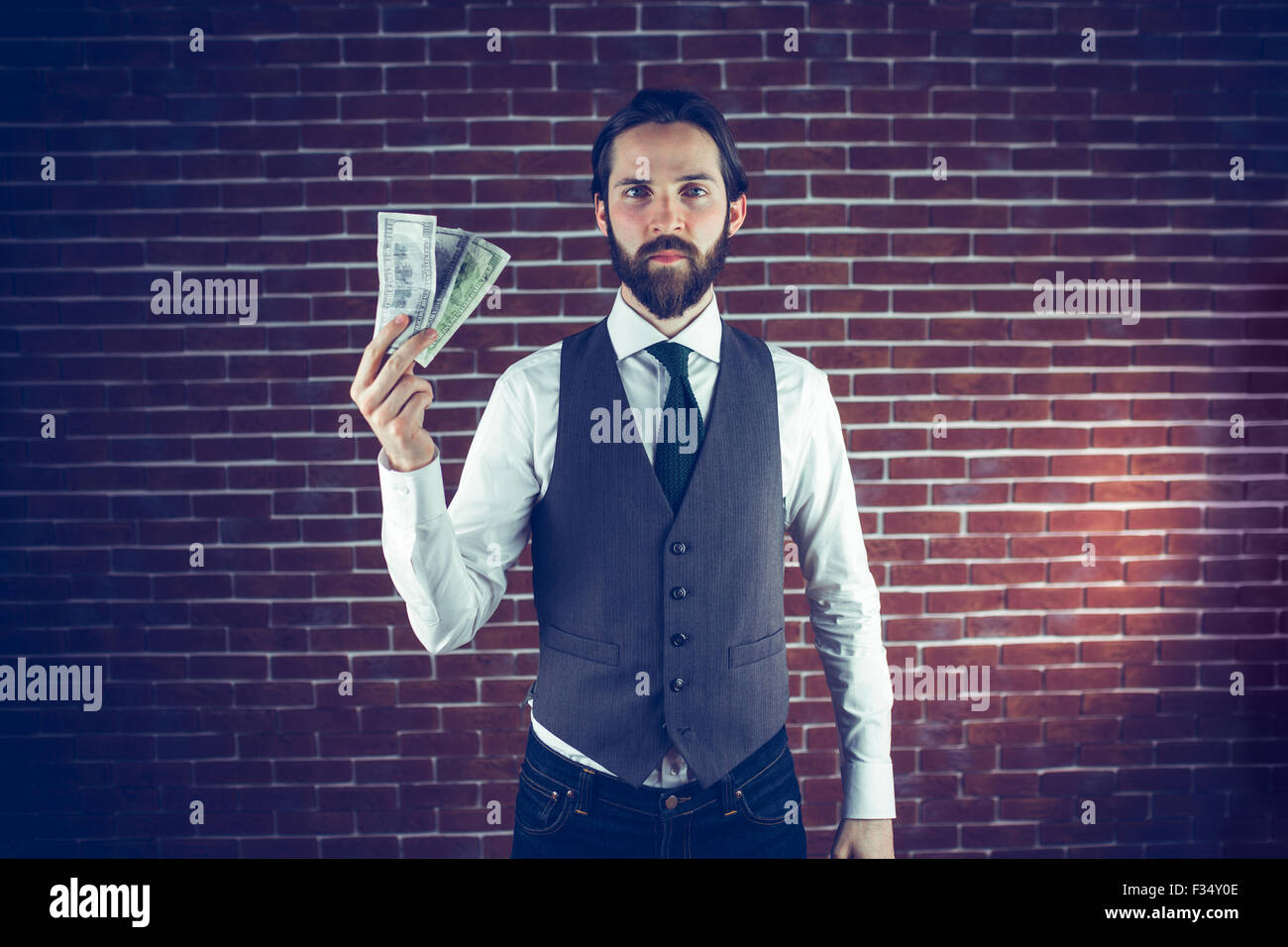 Portrait of man holding money Stock Photo - Alamy