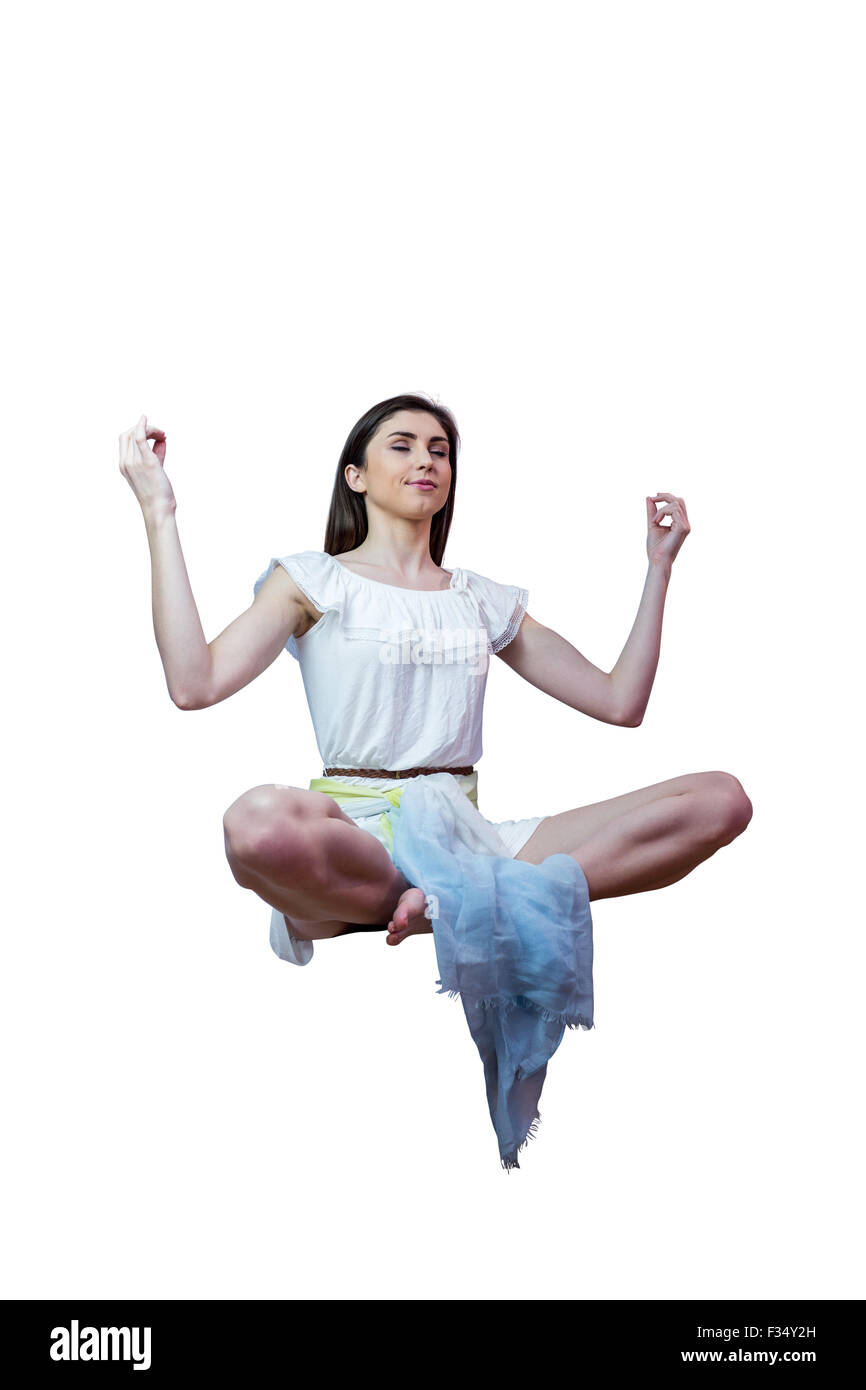 Girl in white dress floating in air Stock Photo - Alamy