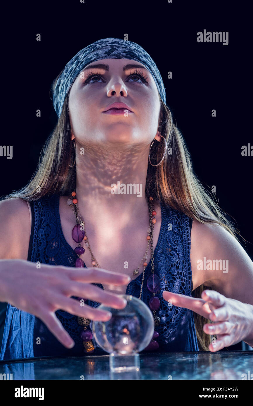 Fortune teller using crystal ball Stock Photo - Alamy