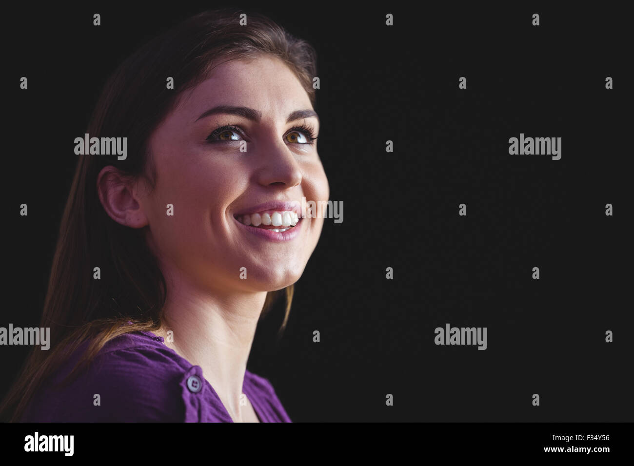 Woman smiling looking up hi-res stock photography and images - Alamy