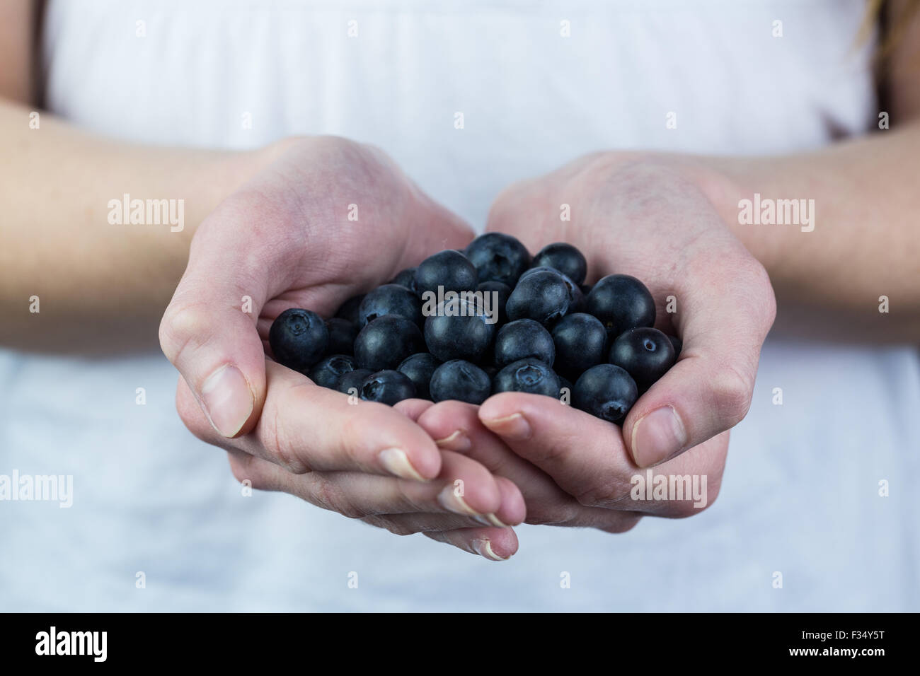 Female eating blueberries hi-res stock photography and images - Alamy