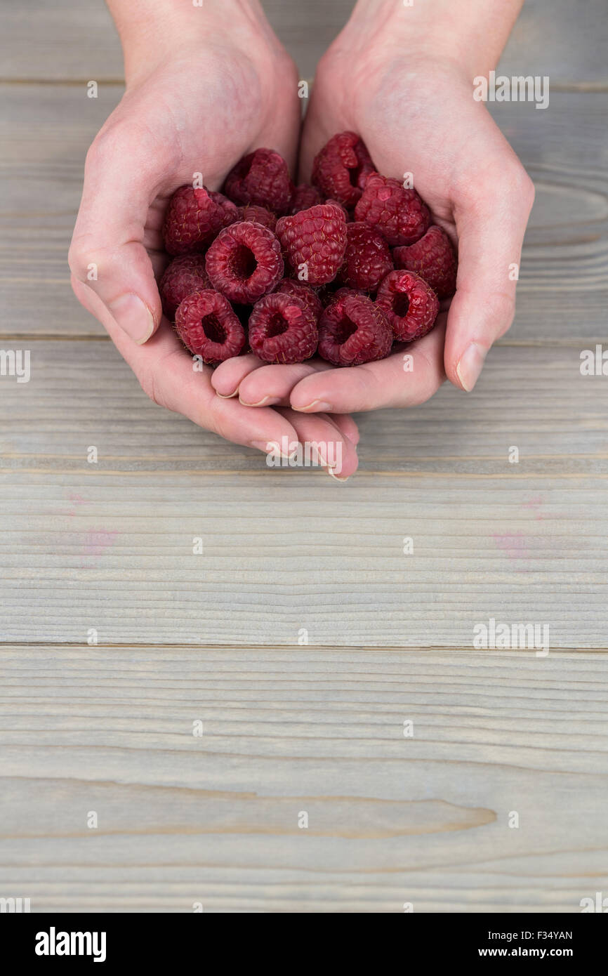 Handful of raspberries hi-res stock photography and images - Alamy