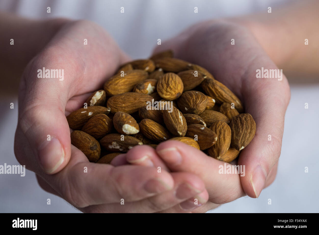 Hands with almonds hi-res stock photography and images - Alamy