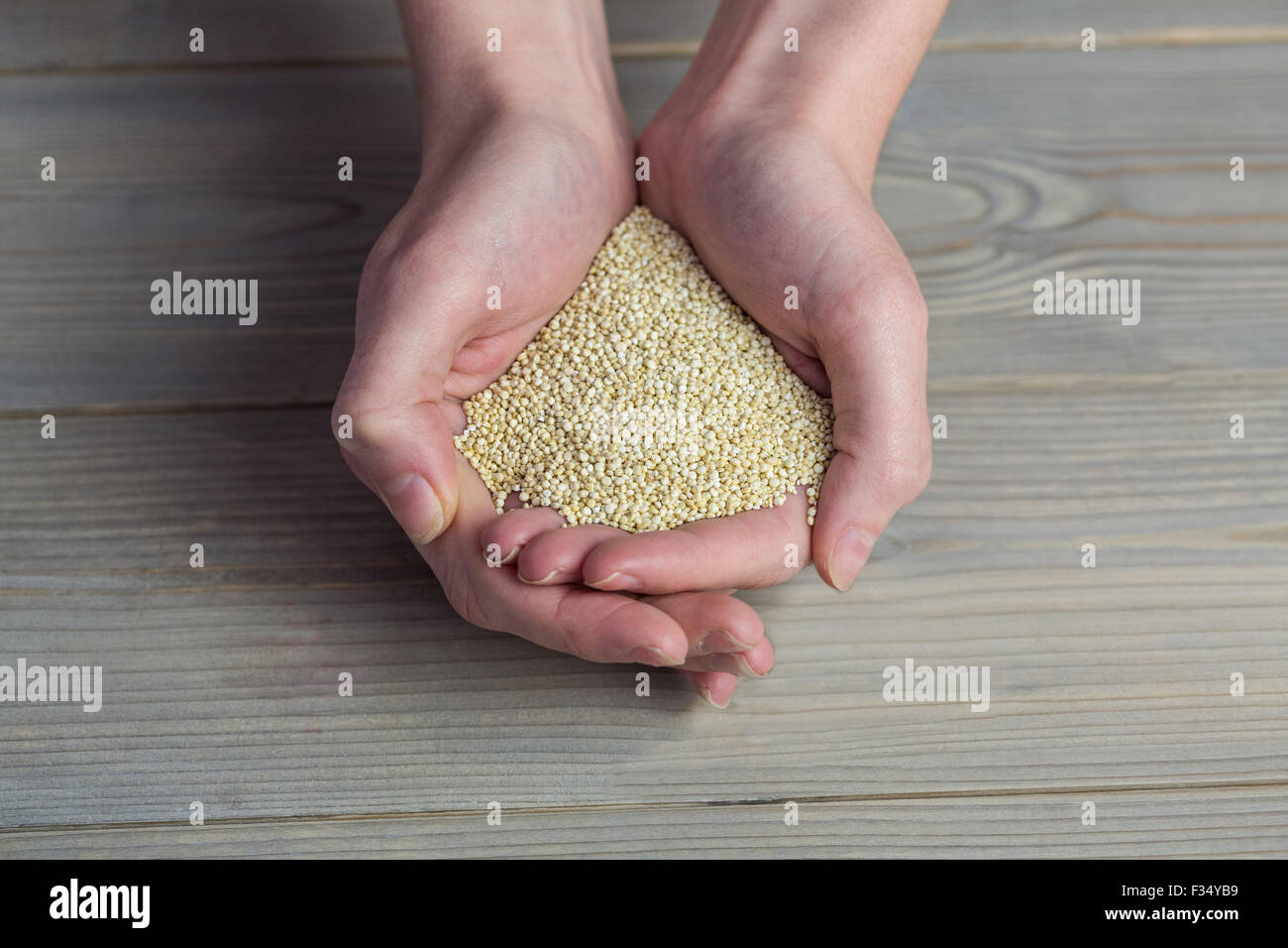 Woman showing handful of sesame seed Stock Photo - Alamy