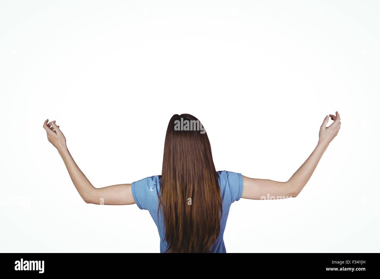 Pretty brunette with arms raised Stock Photo - Alamy