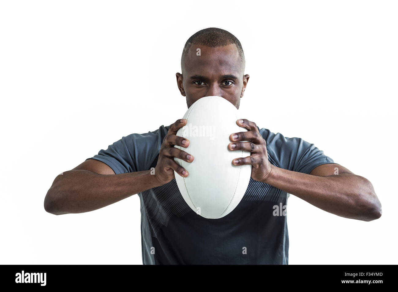 Portrait of sportsman pressing rugby ball Stock Photo - Alamy