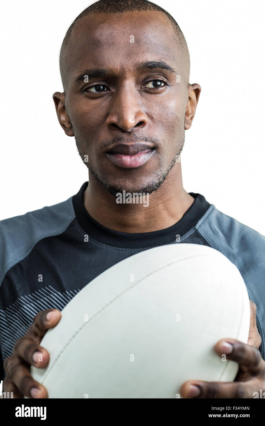 Close-up of athlete thinking while holding rugby ball Stock Photo - Alamy