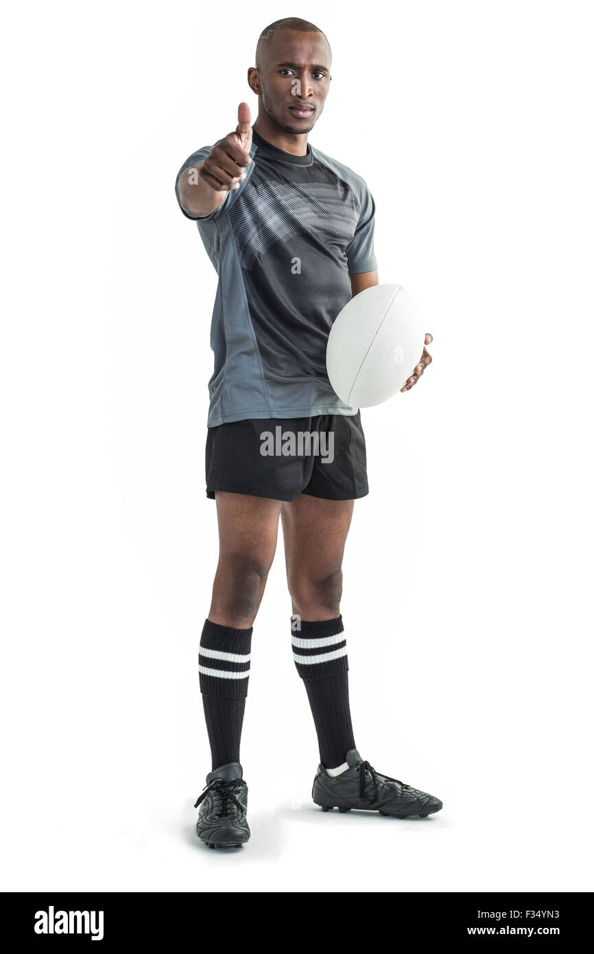 Portrait of confident rugby player showing thumbs up while standing ...