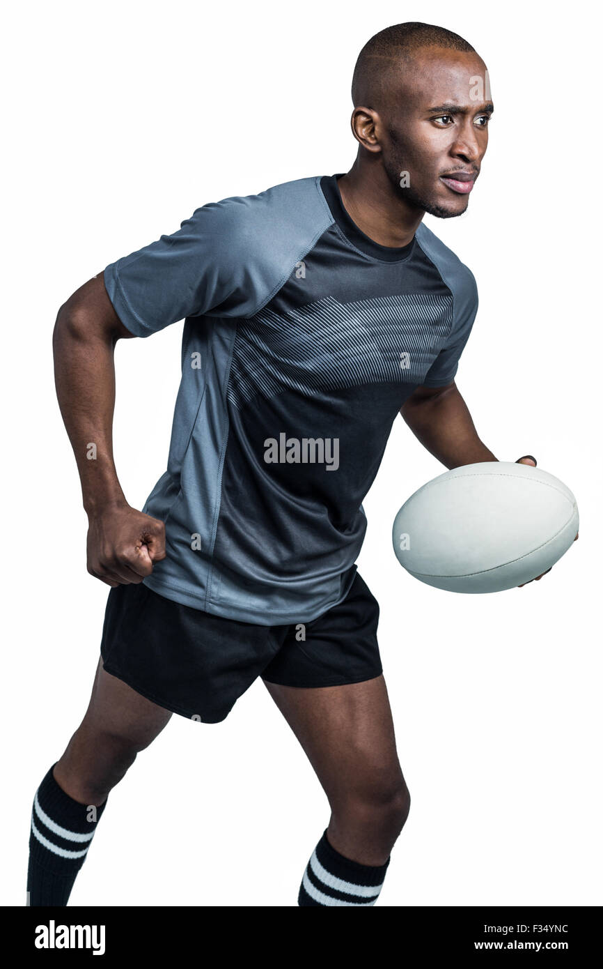 Sportsman running with rugby ball Stock Photo - Alamy