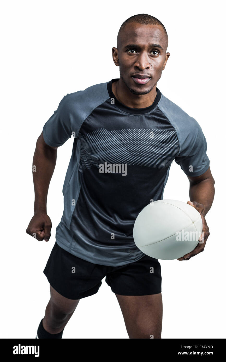 Athlete running with rugby ball Stock Photo - Alamy