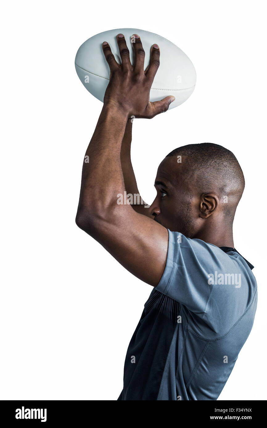 Rugby player throwing ball Stock Photo - Alamy
