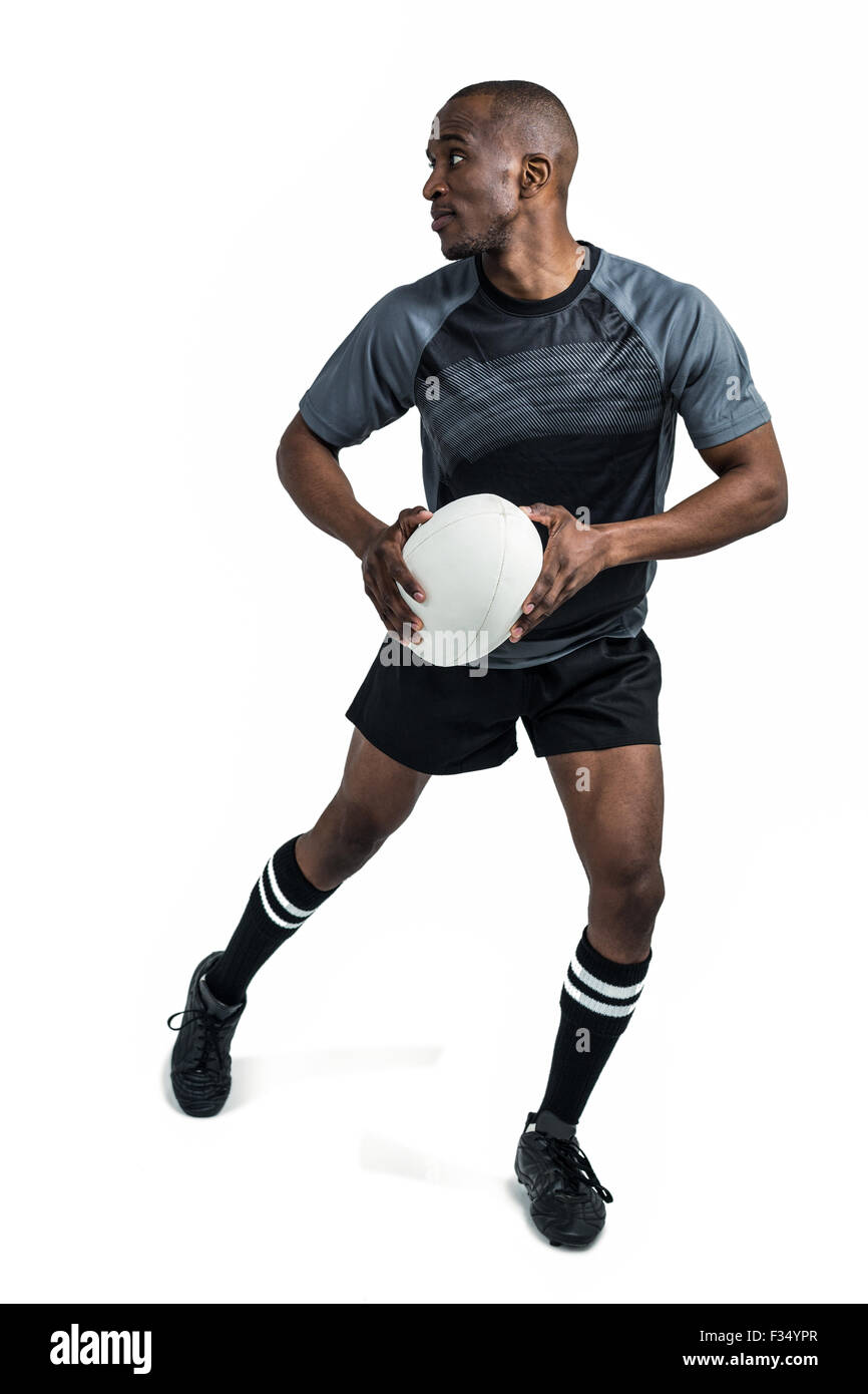 Rugby player with ball running Stock Photo - Alamy