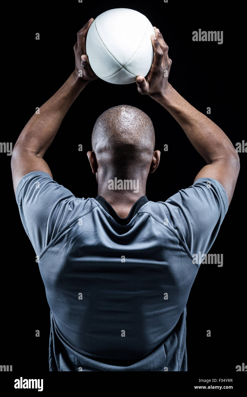 Athlete throwing rugby ball Stock Photo - Alamy