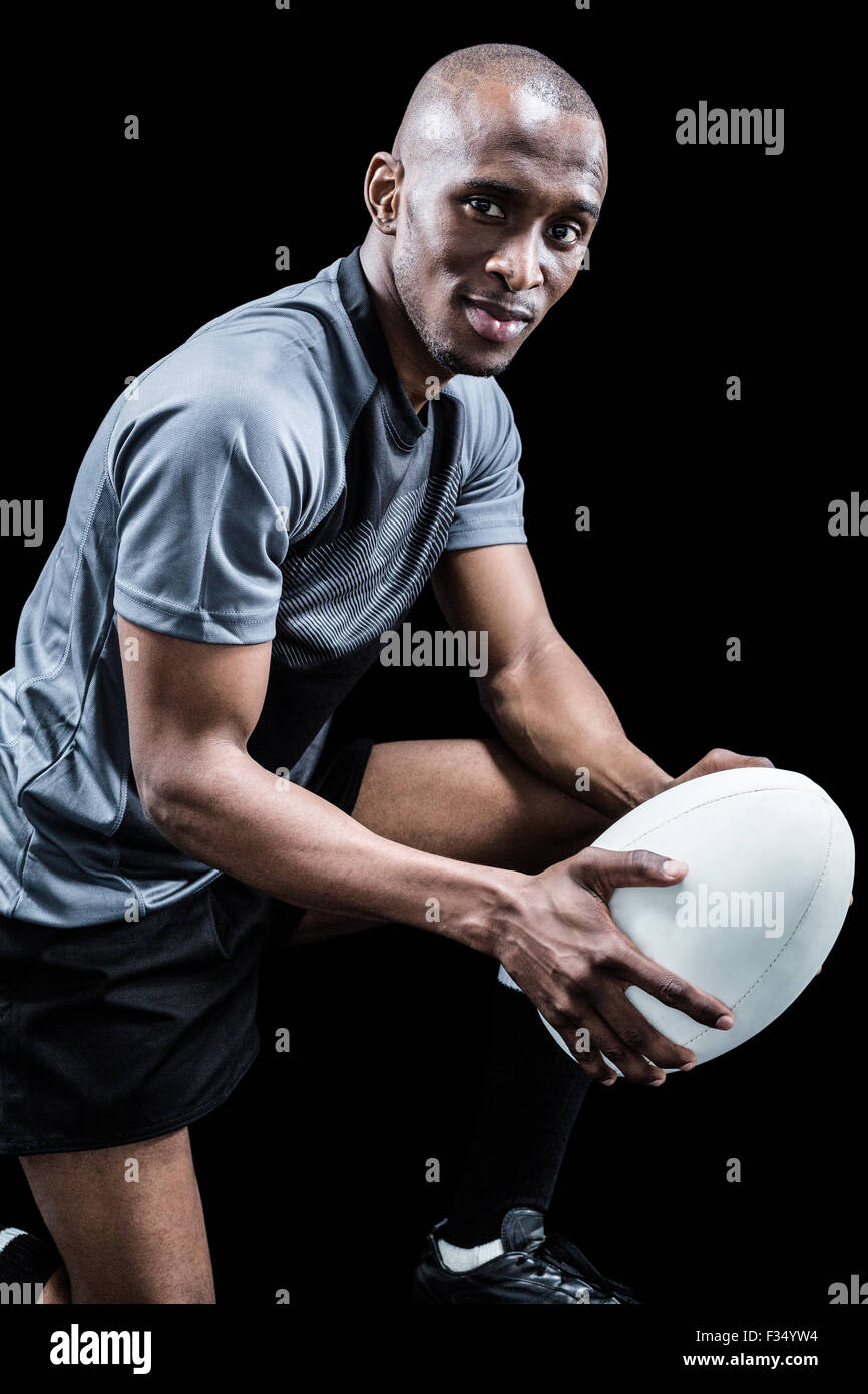 Portrait of confident rugby player with ball Stock Photo - Alamy