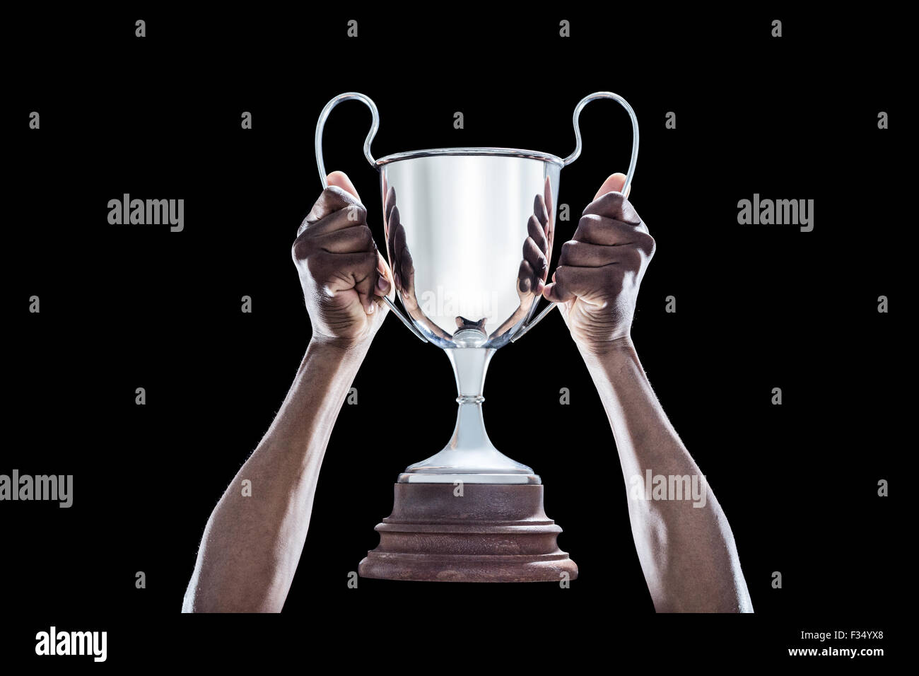 Cropped hand of athlete holding trophy Stock Photo - Alamy