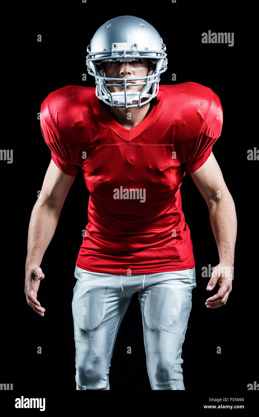 American football player standing in position Stock Photo - Alamy