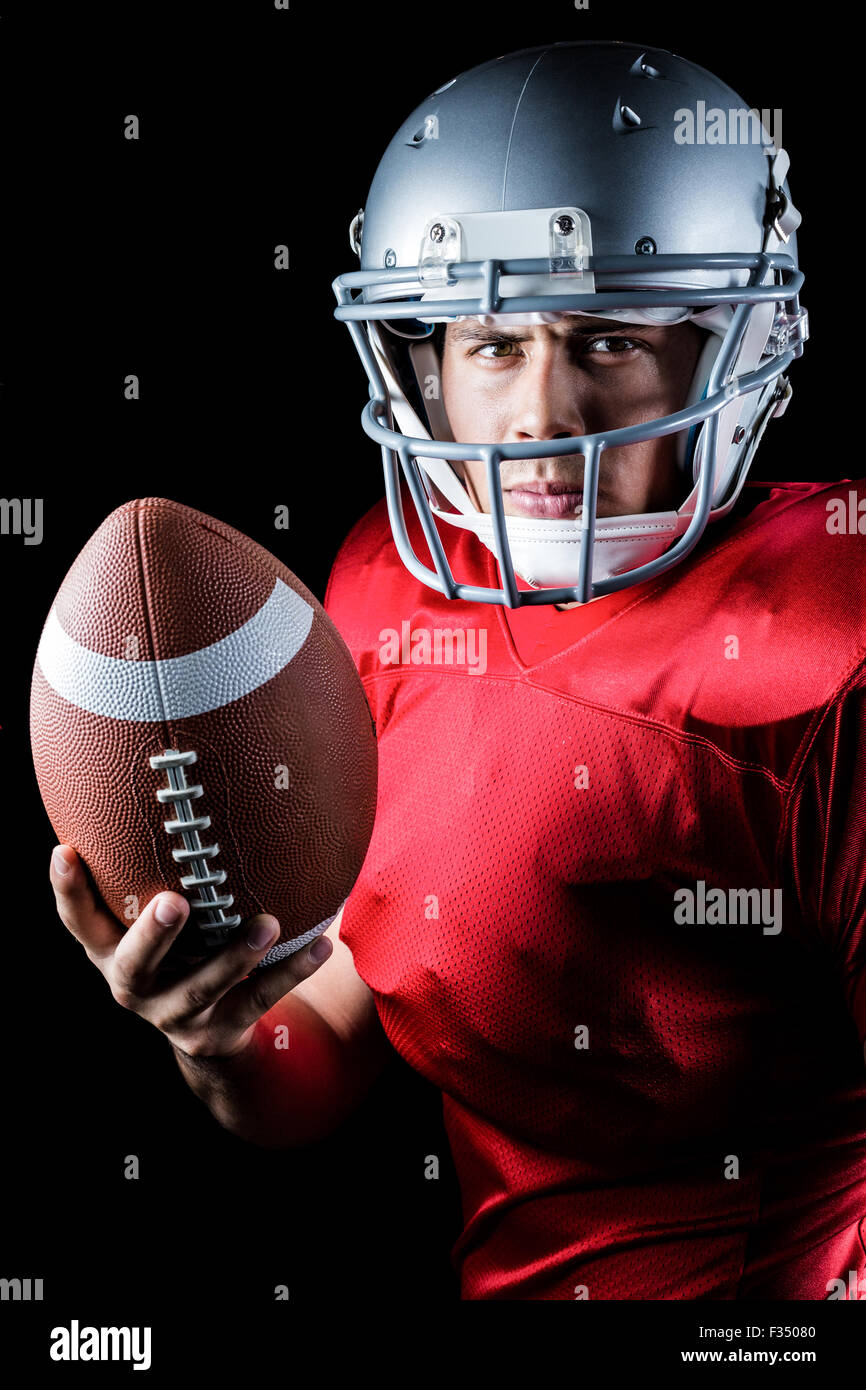 Portrait of determined American football player with ball Stock Photo ...