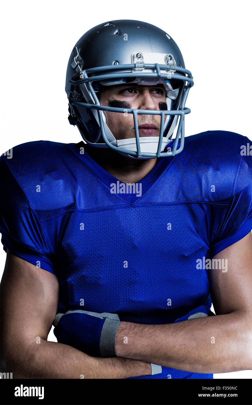 Confident American football player with arms crossed Stock Photo - Alamy