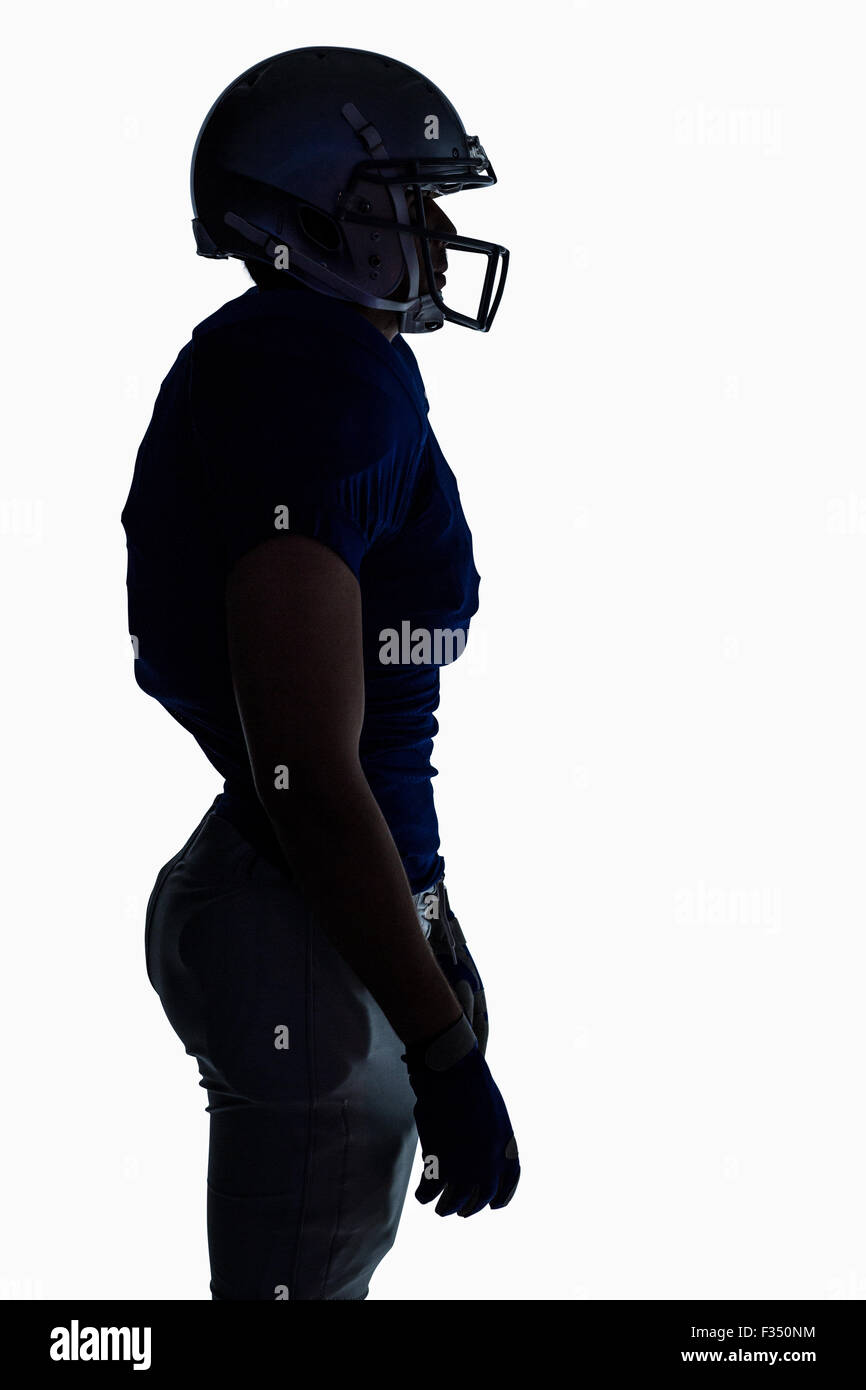 Side view of silhouette American football player standing Stock Photo ...