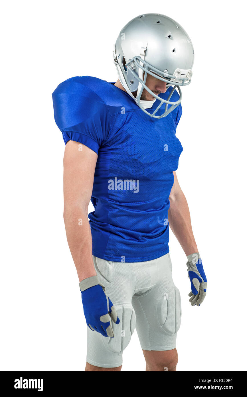 American football player looking down Stock Photo - Alamy