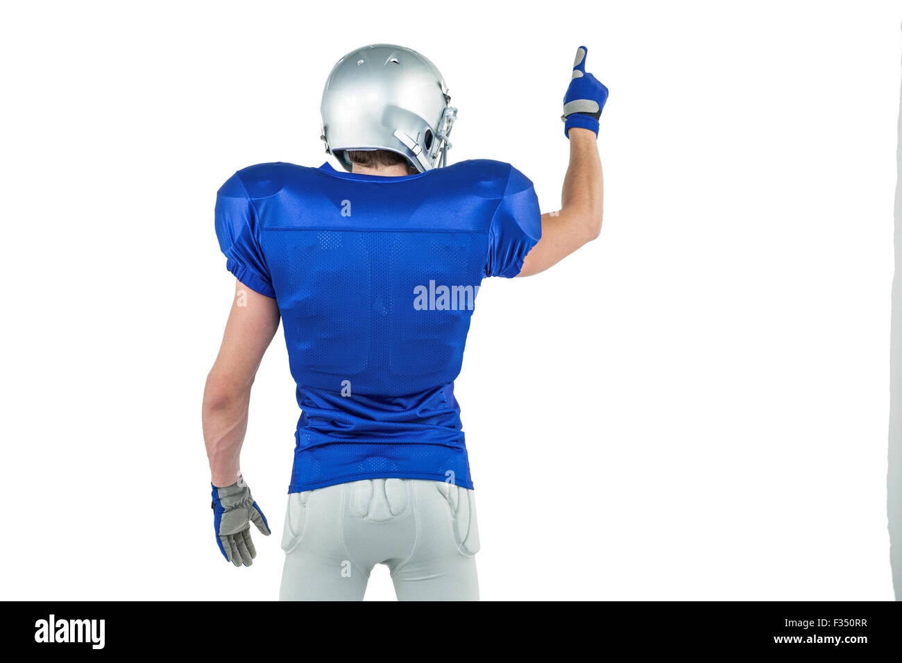Rear view of American football player pointing Stock Photo - Alamy