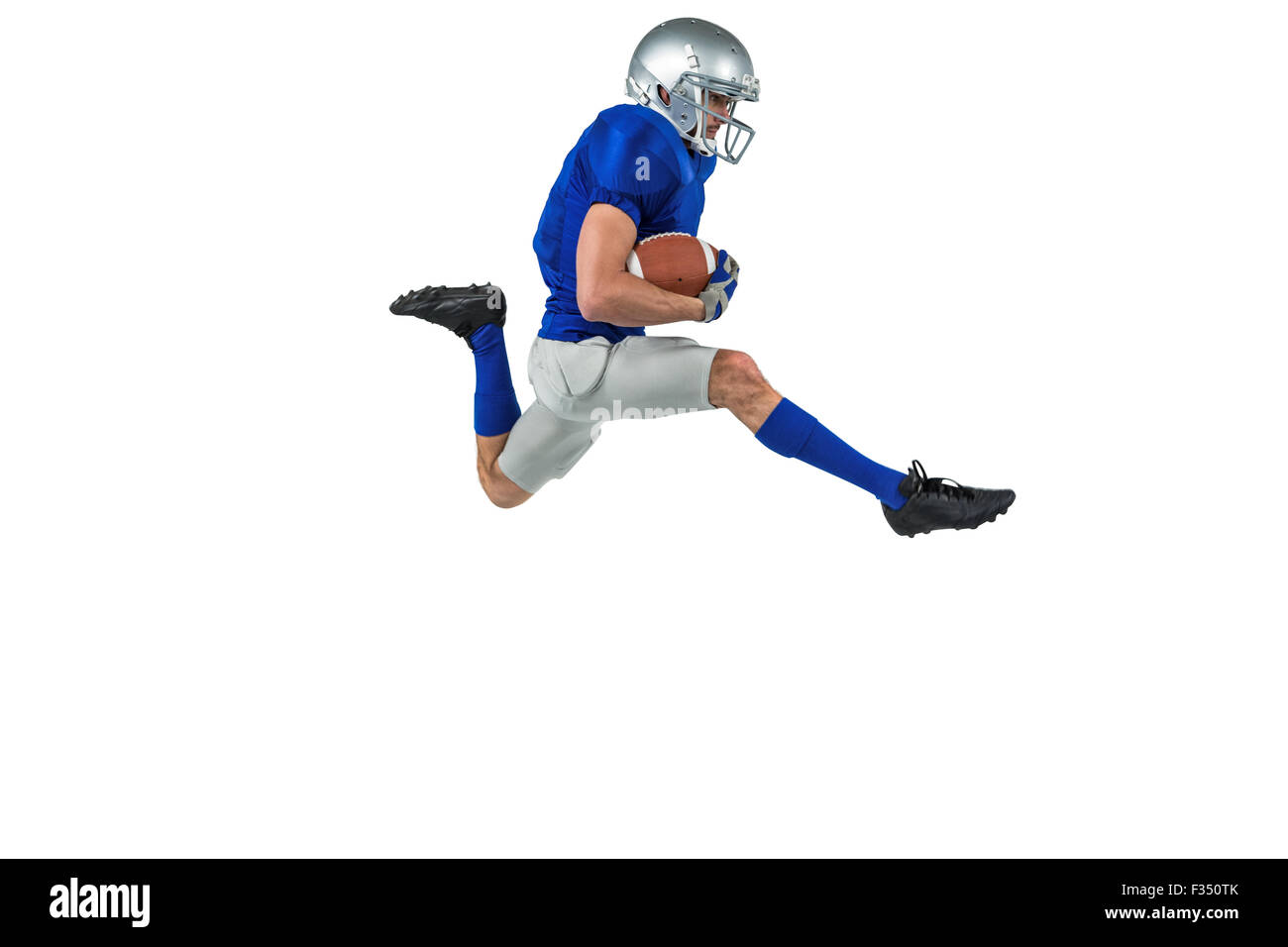 Full length of American football player running with ball Stock Photo ...
