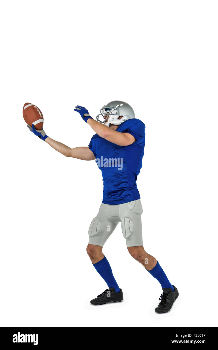 American football player catching ball Stock Photo - Alamy