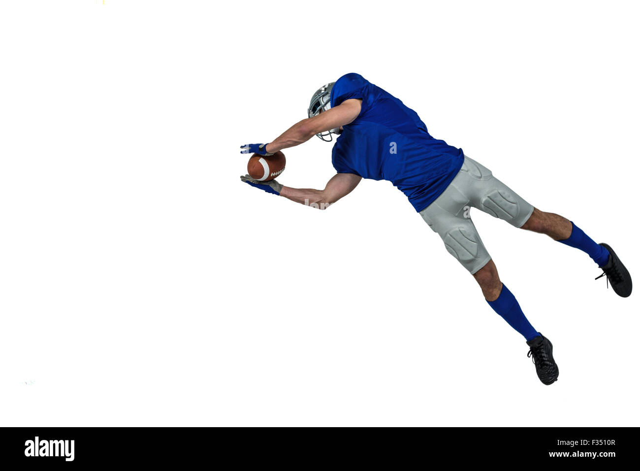 American football player catching ball in mid-air Stock Photo - Alamy