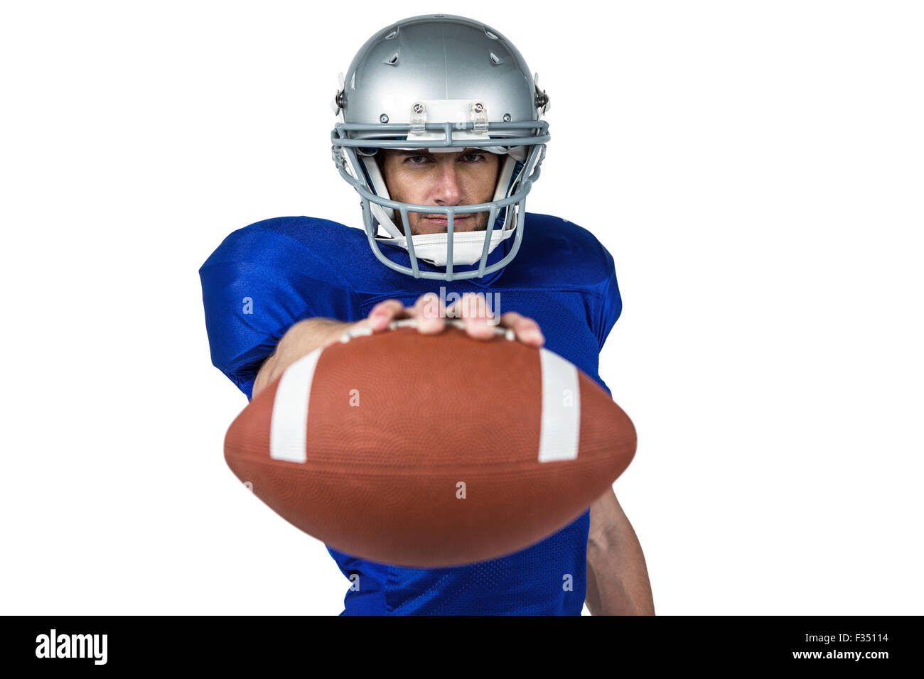 American football player holding ball Stock Photo - Alamy