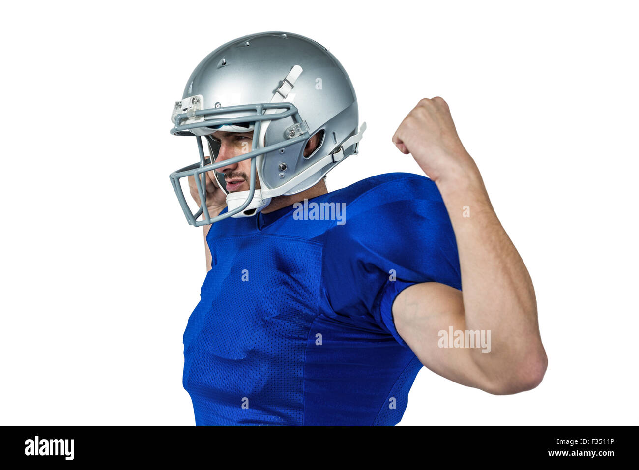 Confident American football player flexing muscles Stock Photo - Alamy