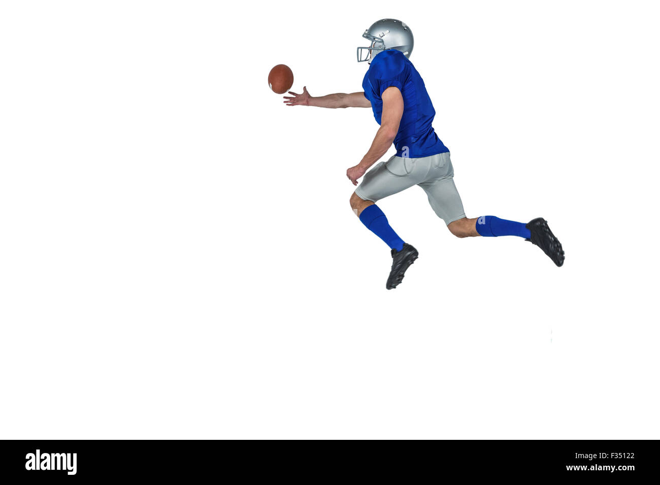 American football player trying to catch the ball Stock Photo - Alamy
