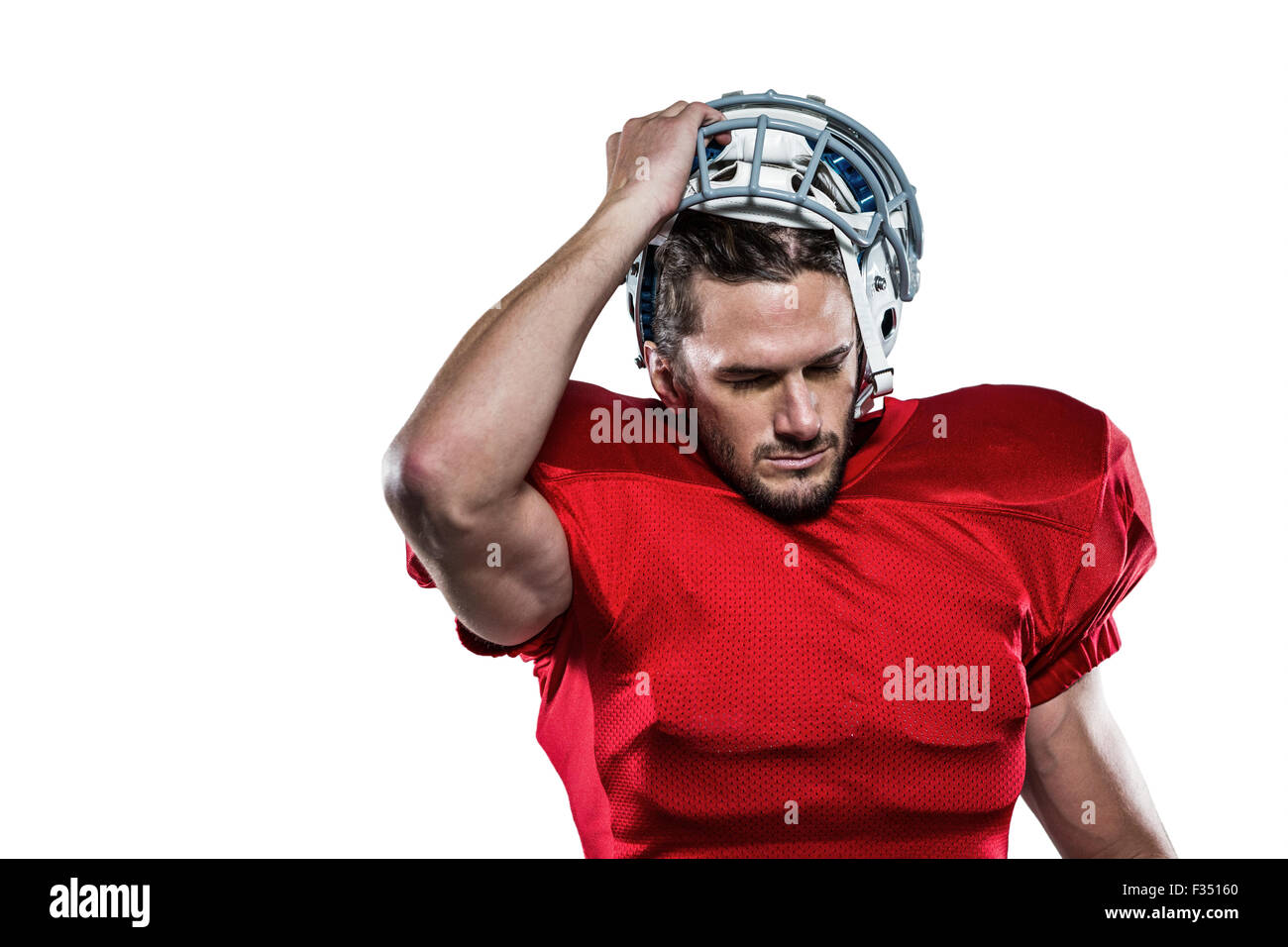 American football player in removing helmet Stock Photo - Alamy