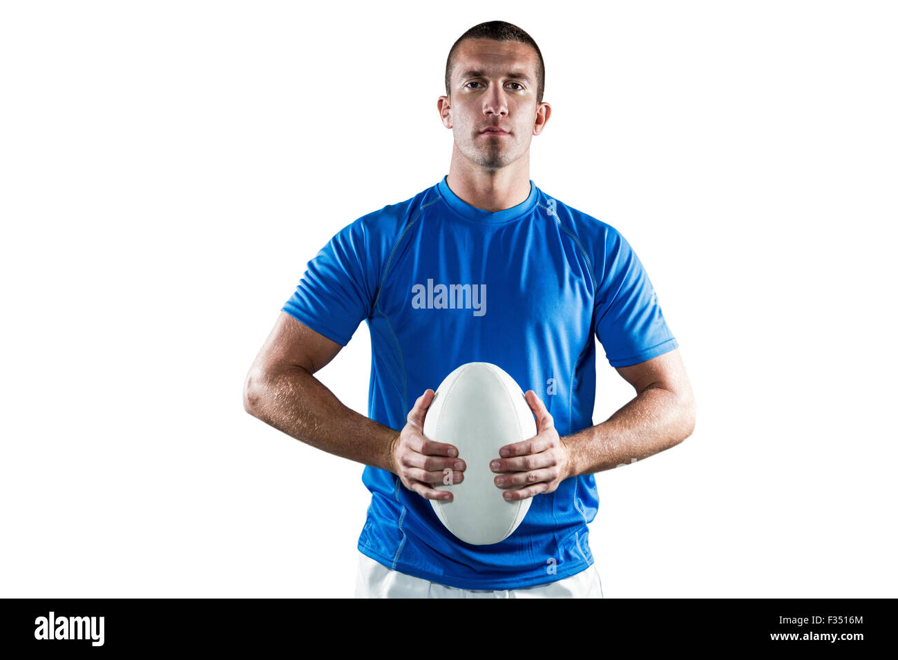 Handsome rugby player in blue jersey holding ball Stock Photo - Alamy