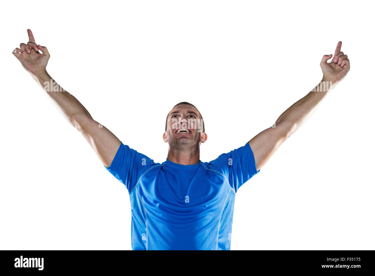 Happy rugby player with arms raised Stock Photo - Alamy