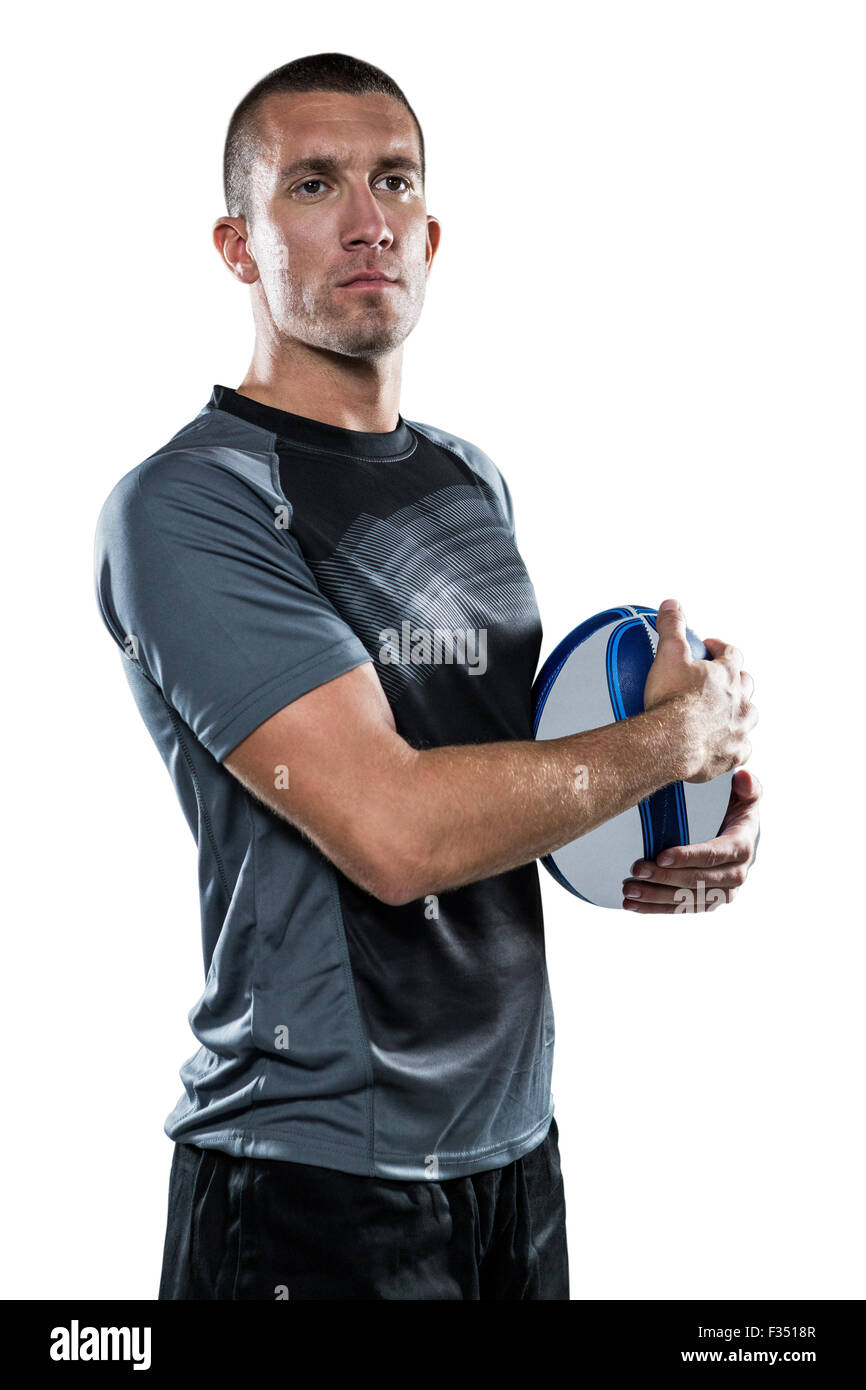 Confident rugby player in holding ball Stock Photo - Alamy